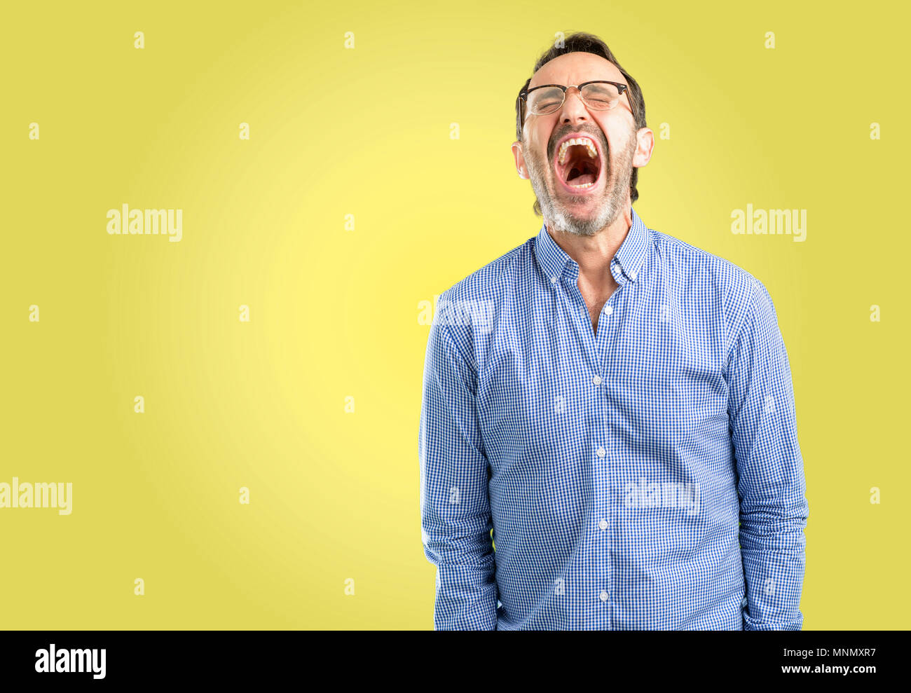 Handsome middle age man stressful, terrified in panic, shouting ...