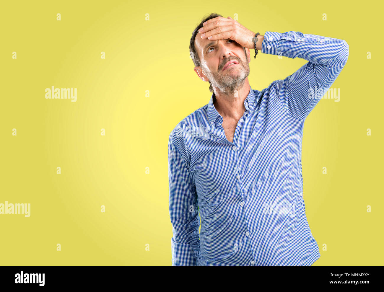 Handsome middle age man terrified and nervous expressing anxiety and ...