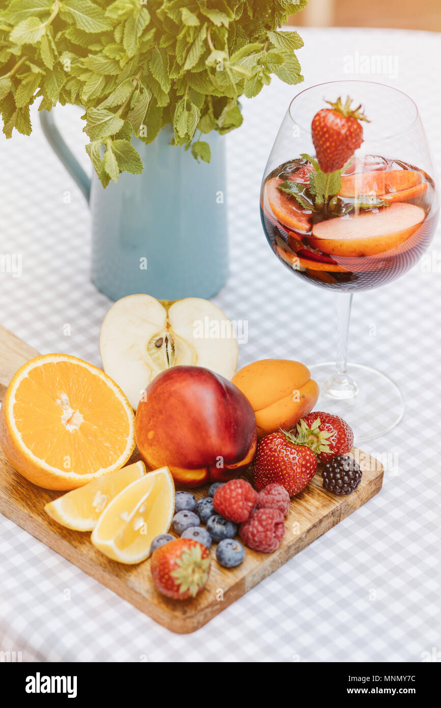 Top view of summer dinks, fruit cocktails on white wood table with ...