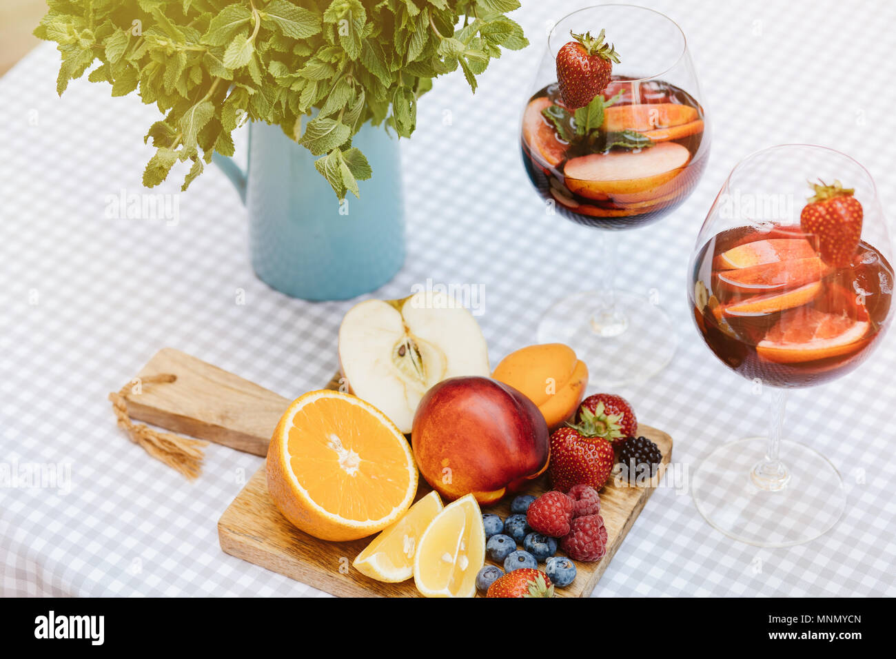 Top view of summer dinks, fruit cocktails on white wood table with ...