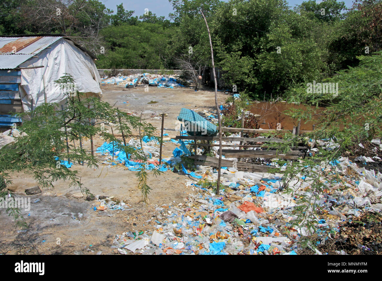Littering of garbage in front of private houses along colombian coast ...