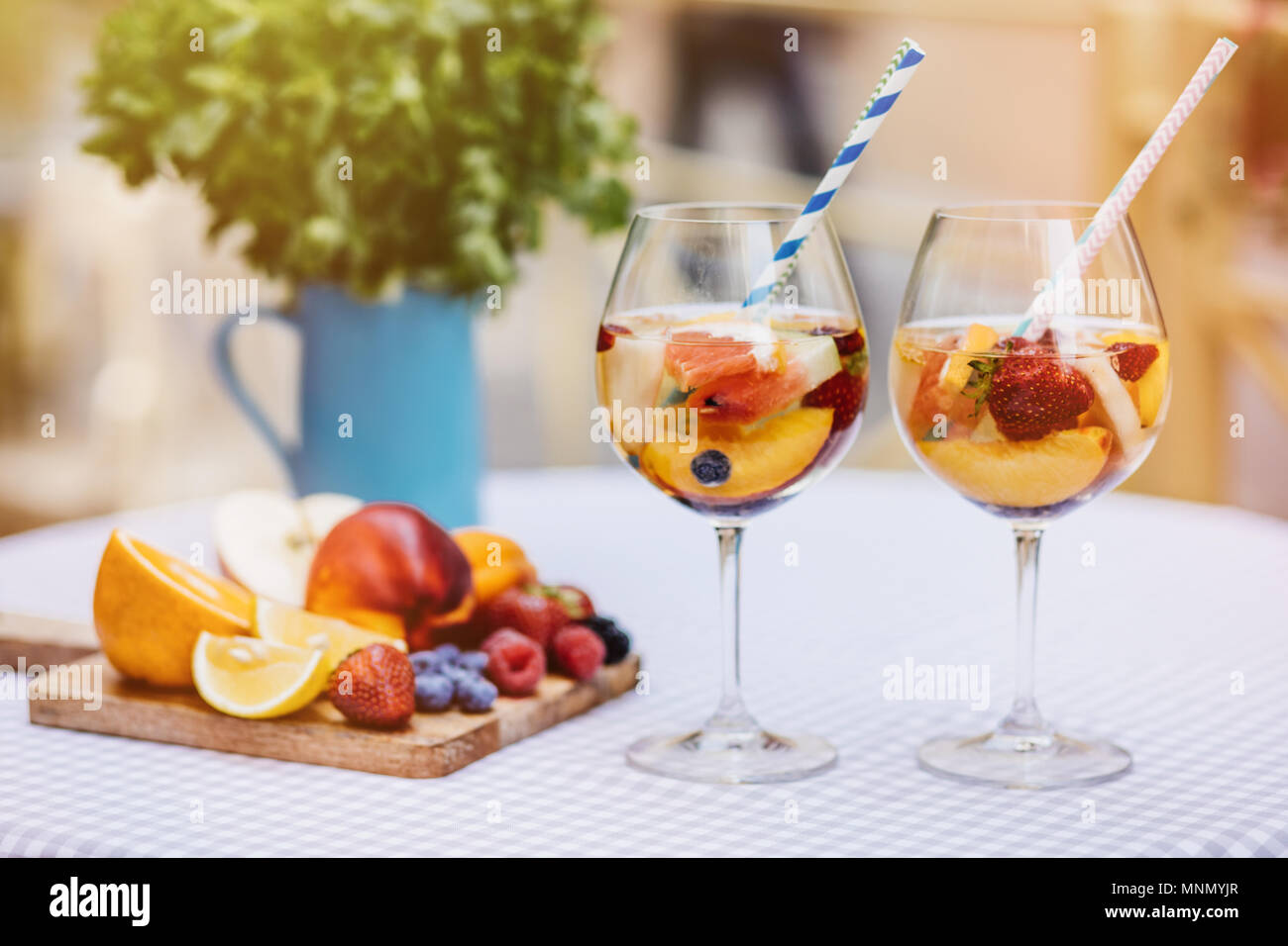 Top view of summer dinks, fruit cocktails on white wood table with ...