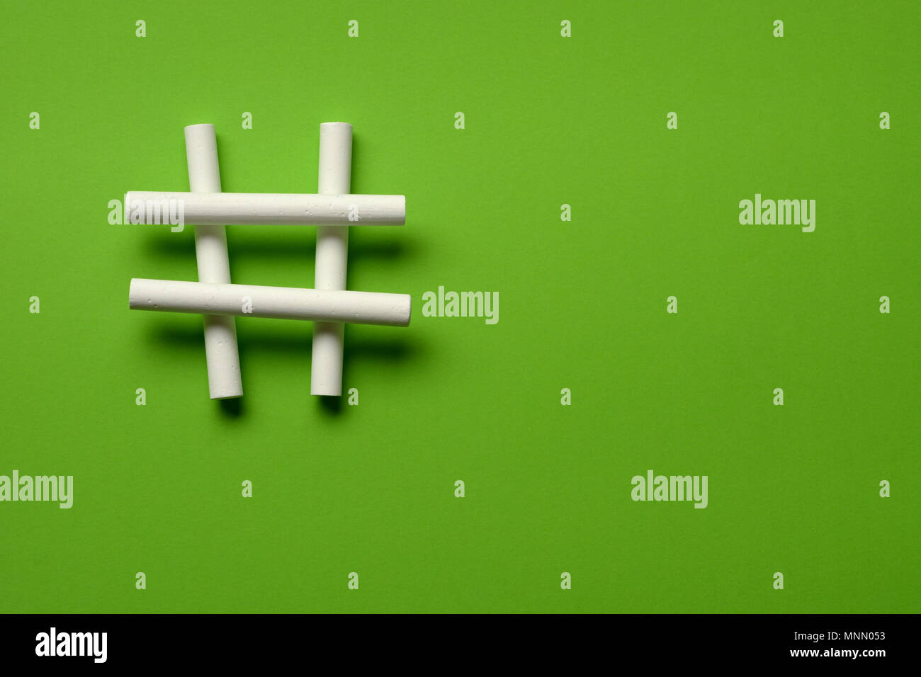 the hashtag symbol made with chalks - green background - closeup Stock ...