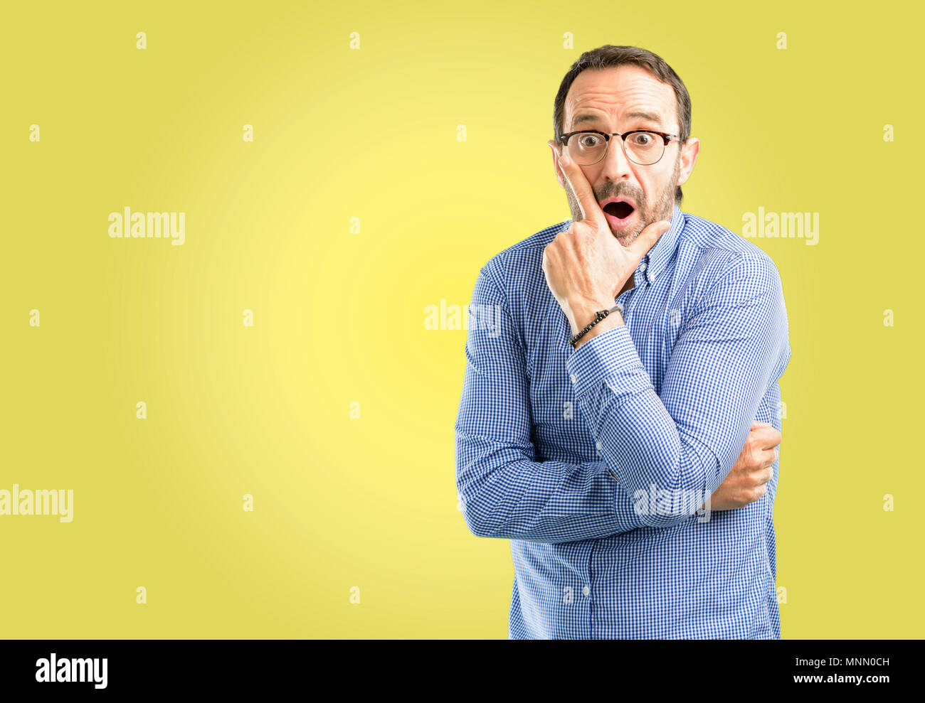 Handsome middle age man scared in shock, expressing panic and fear Stock Photo - Alamy