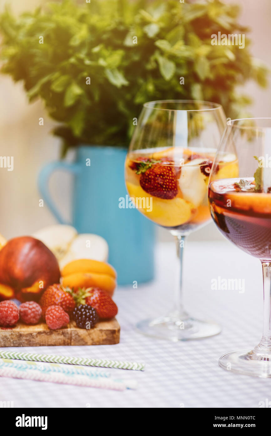 Top view of summer dinks, fruit cocktails on white wood table with ...
