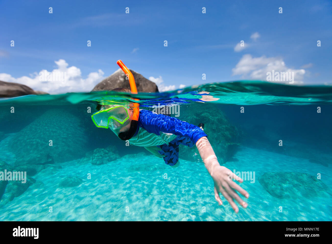 Boy Swimming Underwater In Ocean