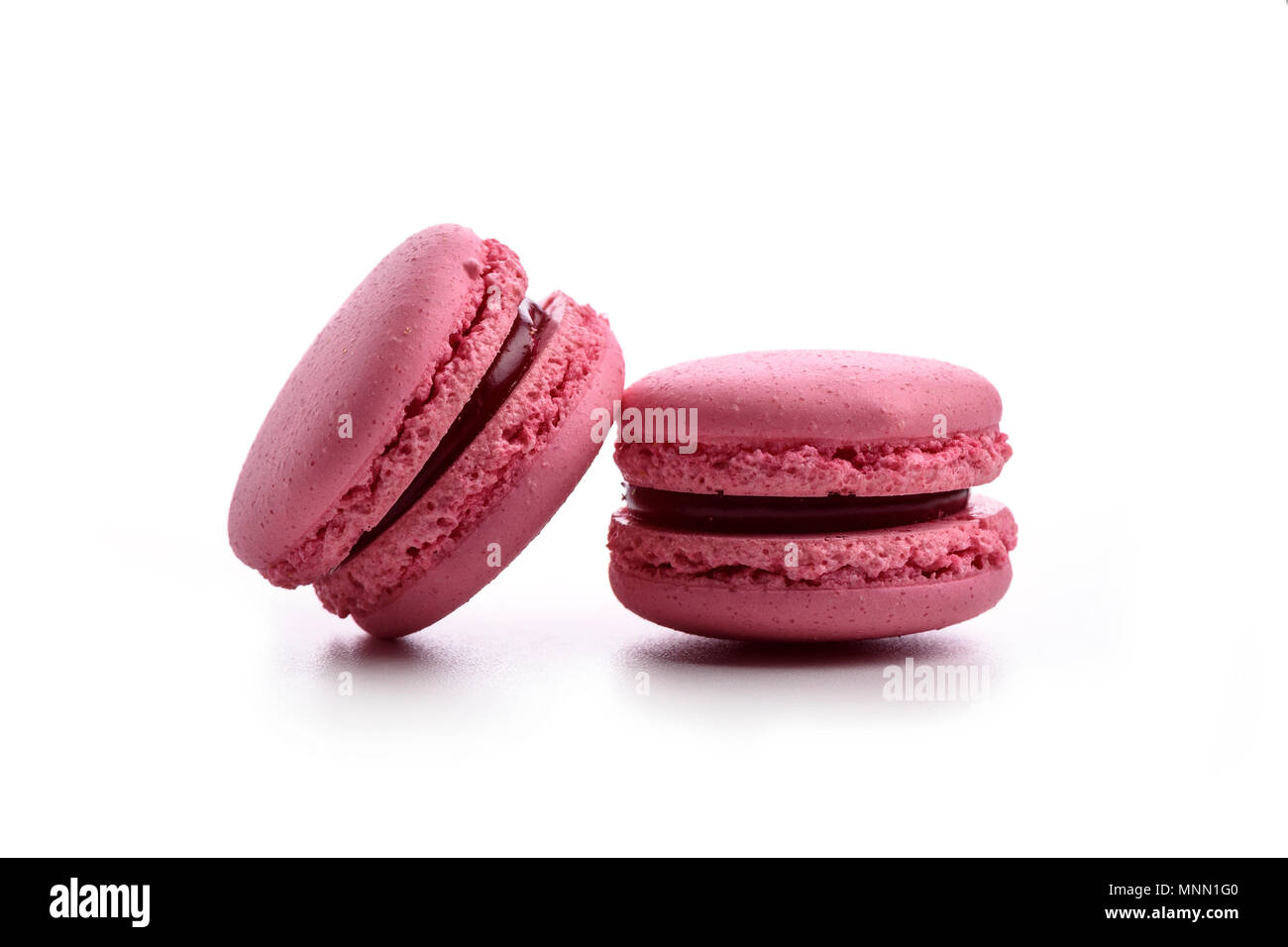 Two pink macaroons isolated on white background Stock Photo - Alamy