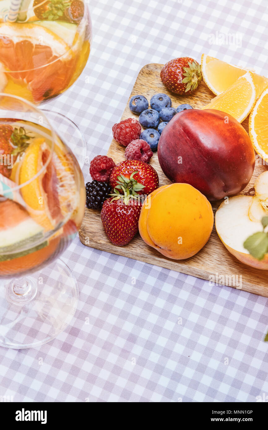 Top view of summer dinks, fruit cocktails on white wood table with ...
