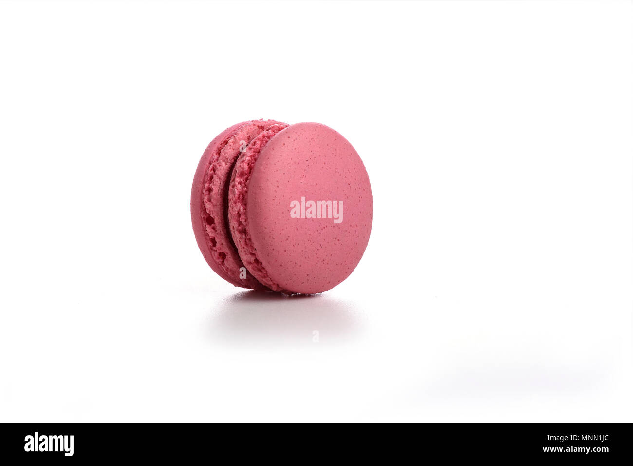 Pink sweet macaroon isolated on white background Stock Photo - Alamy