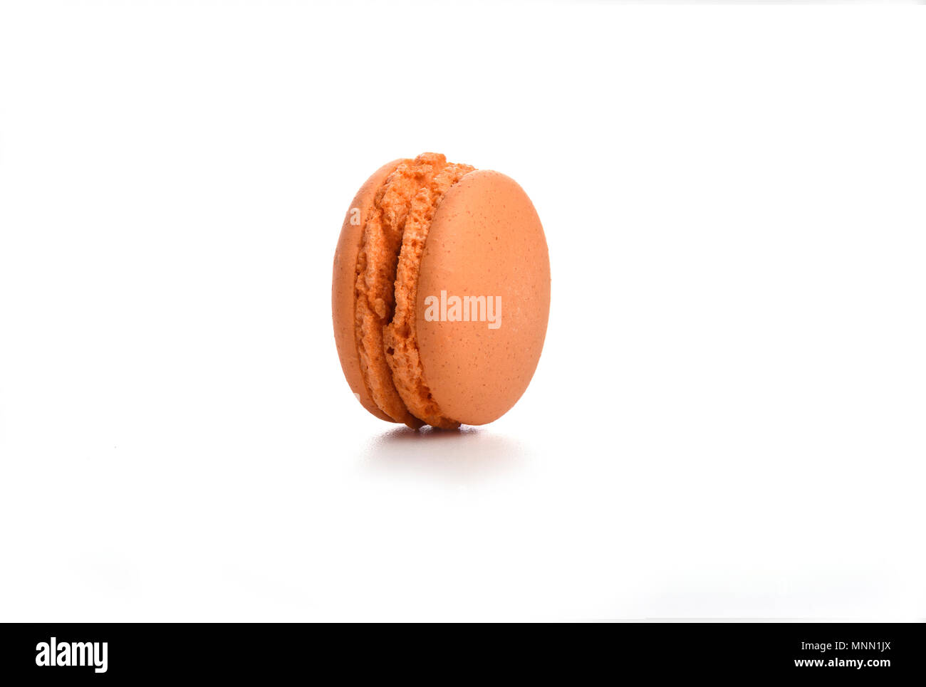 Orange macaroon isolated on white background, close up Stock Photo - Alamy