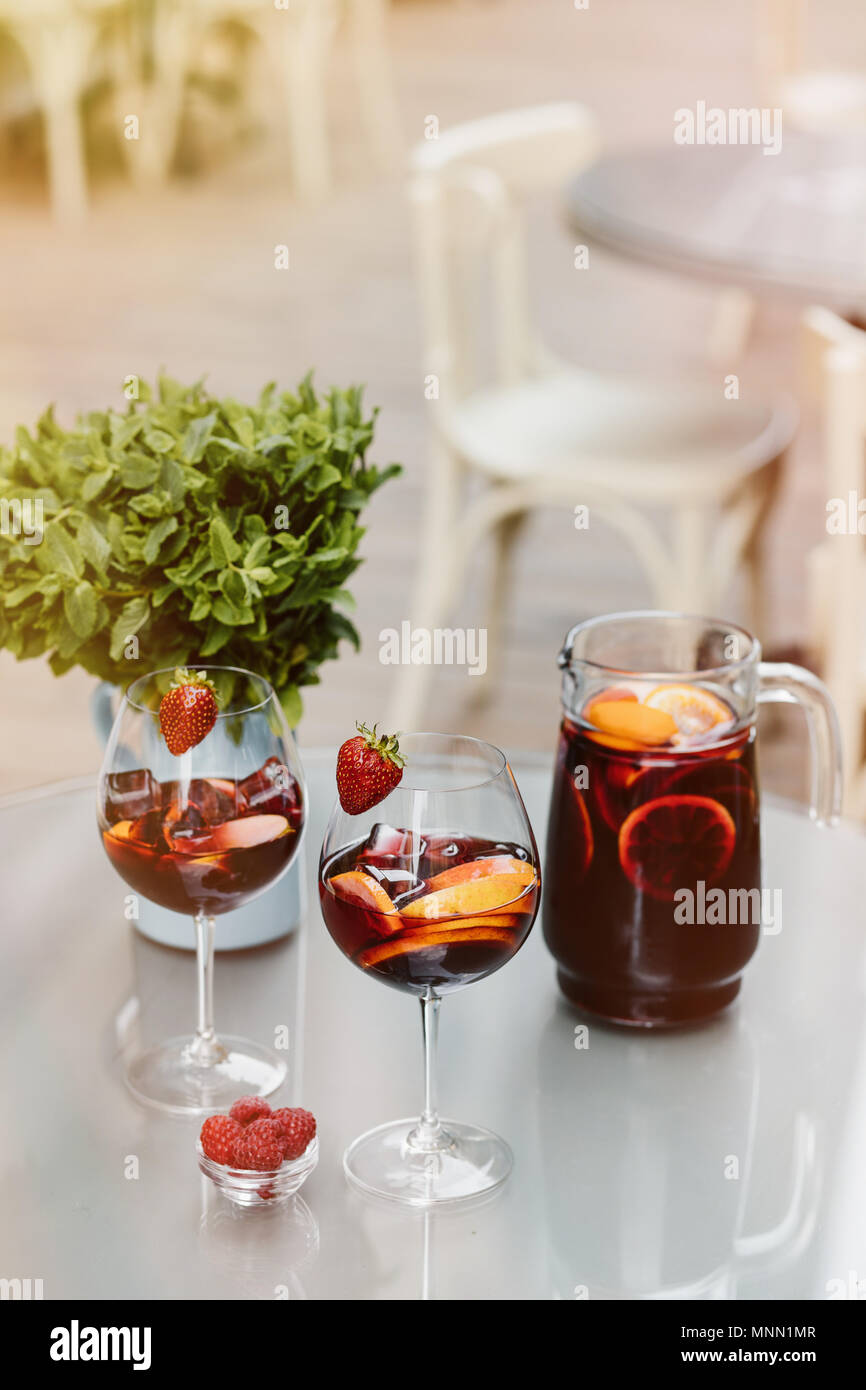 Top view of summer dinks, fruit cocktails on white wood table with ...