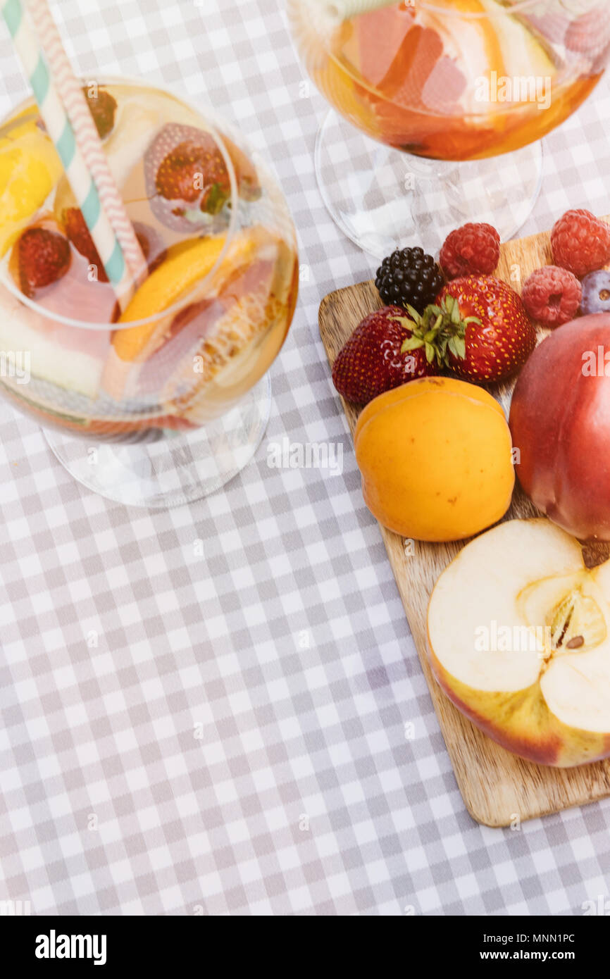 Top view of summer dinks, fruit cocktails on white wood table with ...
