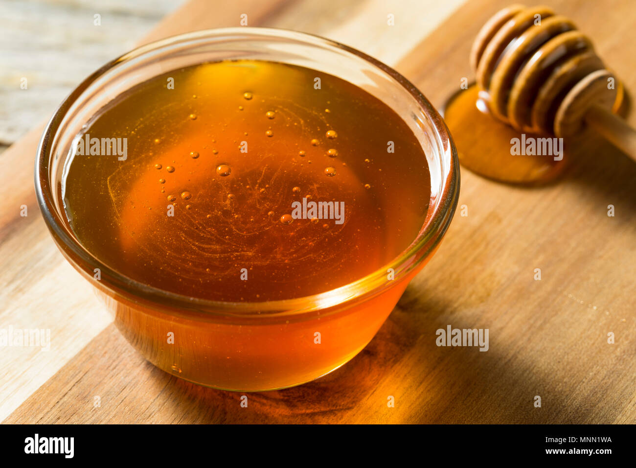 Raw Dark Organic BuckWheat Honey in a Bowl Stock Photo - Alamy