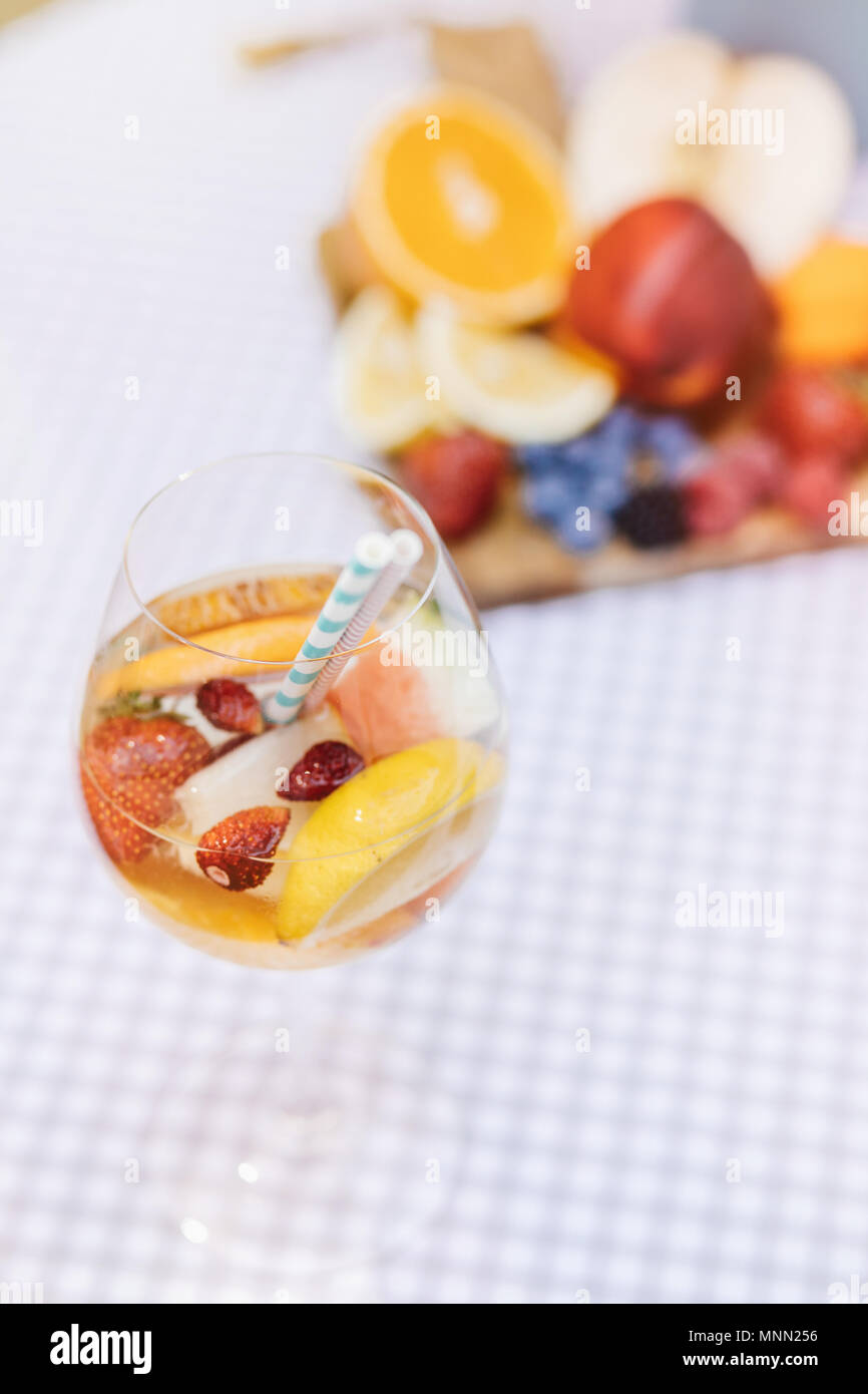 Top view of summer dinks, fruit cocktails on white wood table with ...