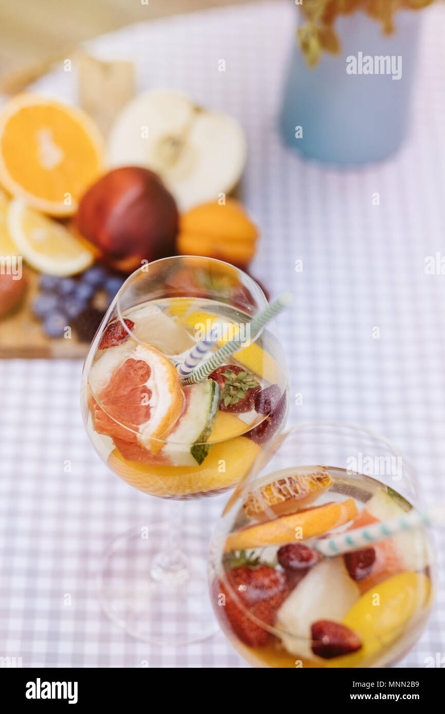 Top view of summer dinks, fruit cocktails on white wood table with ...