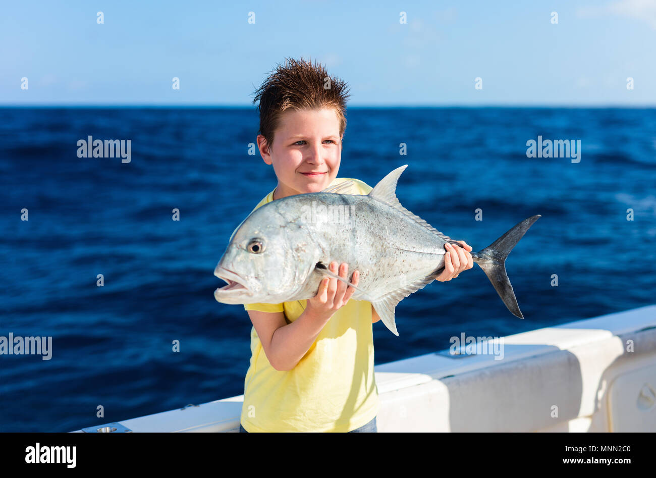 Boy saltwater fishing hi-res stock photography and images - Alamy
