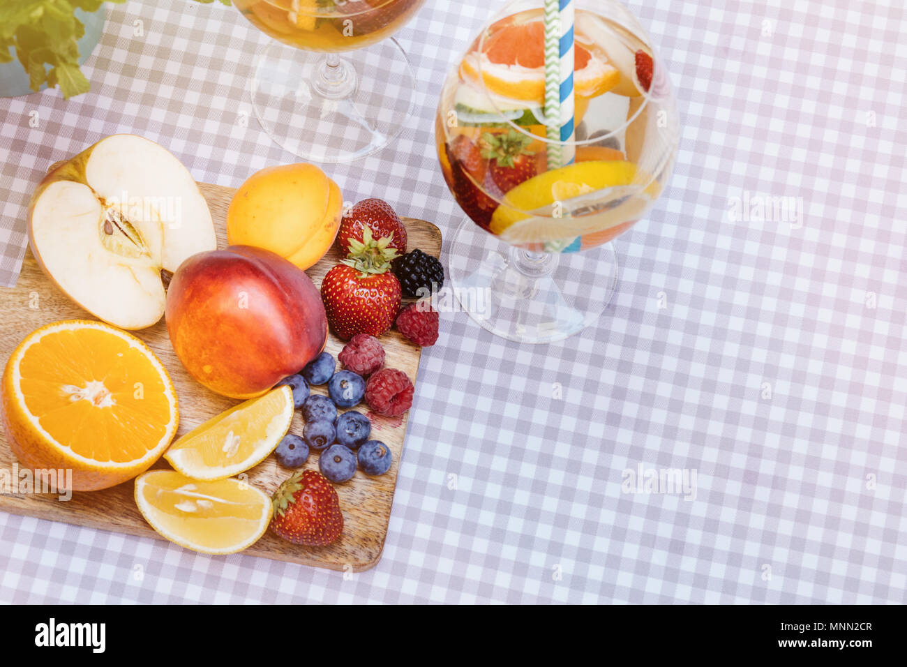 Top view of summer dinks, fruit cocktails on white wood table with ...