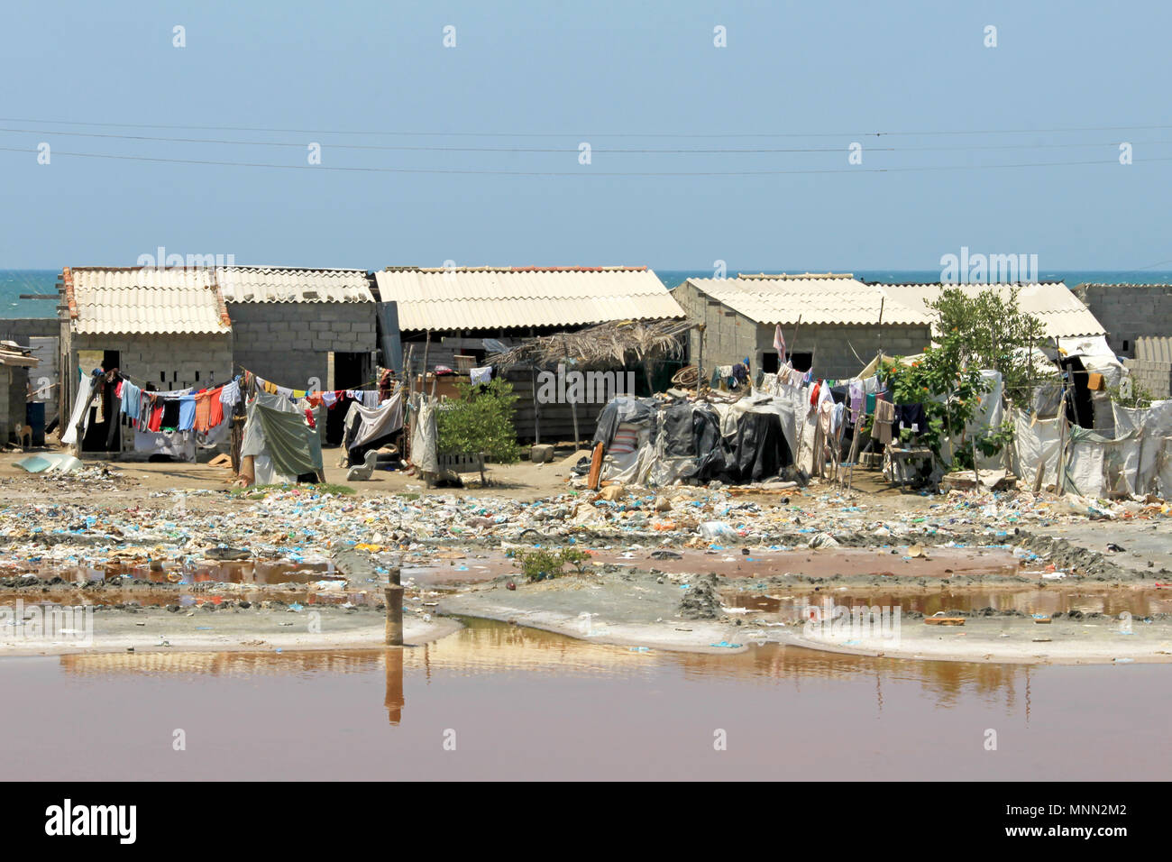 Littering of garbage in front of private houses along colombian coast ...