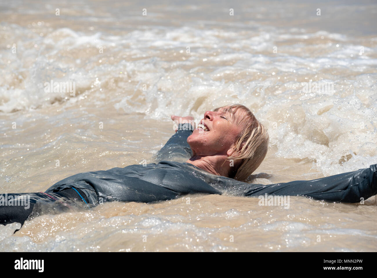 Woman laying on beach hi-res stock photography and images - Alamy