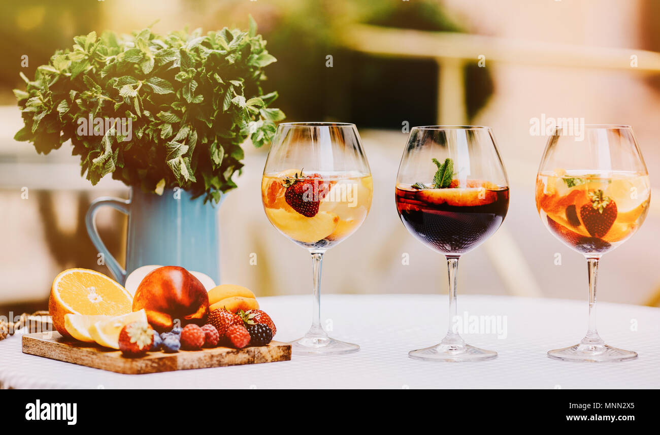 Top view of summer dinks, fruit cocktails on white wood table with ...