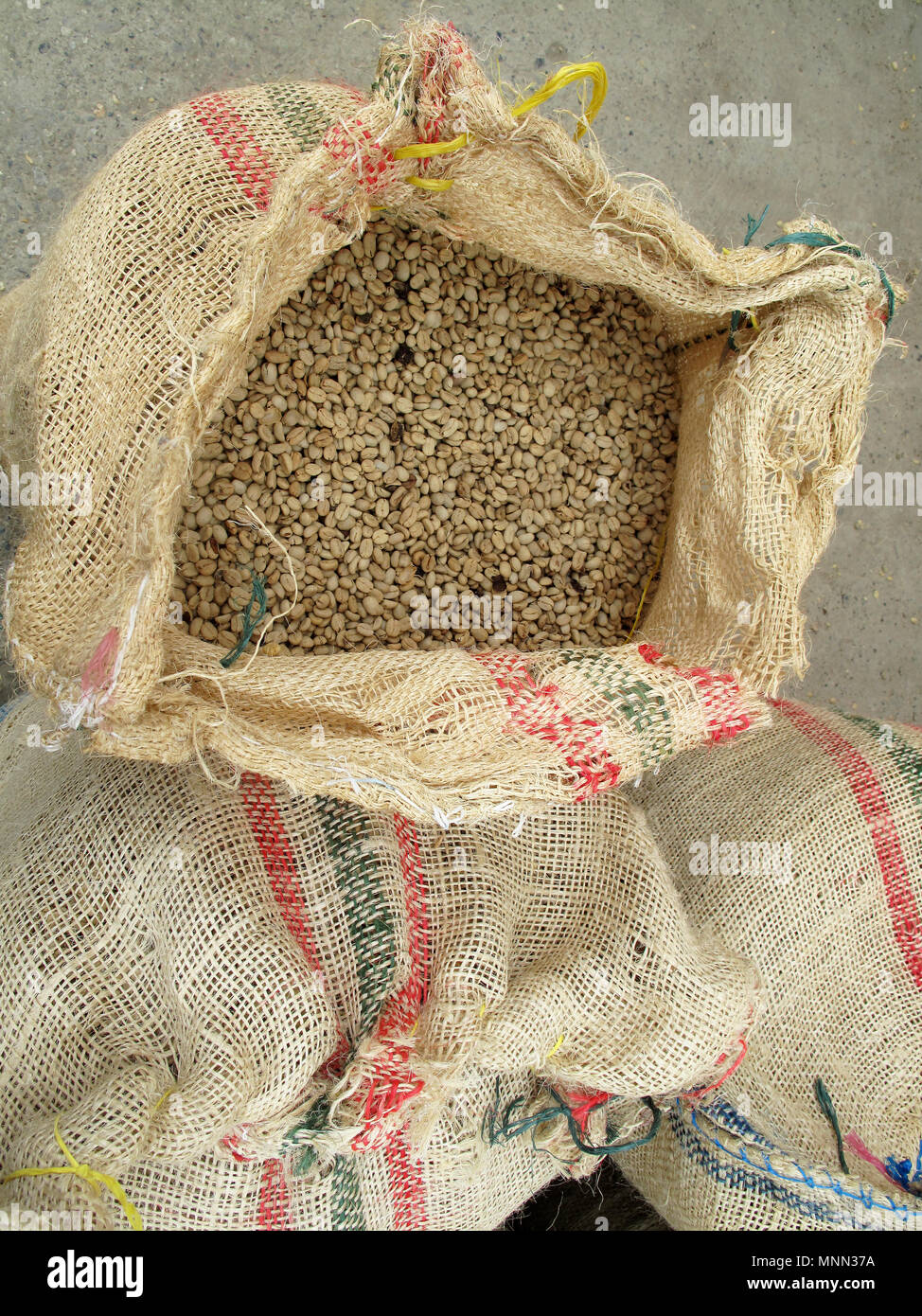 Not roasted coffee beans in jute sack top view, Colombia Stock Photo ...