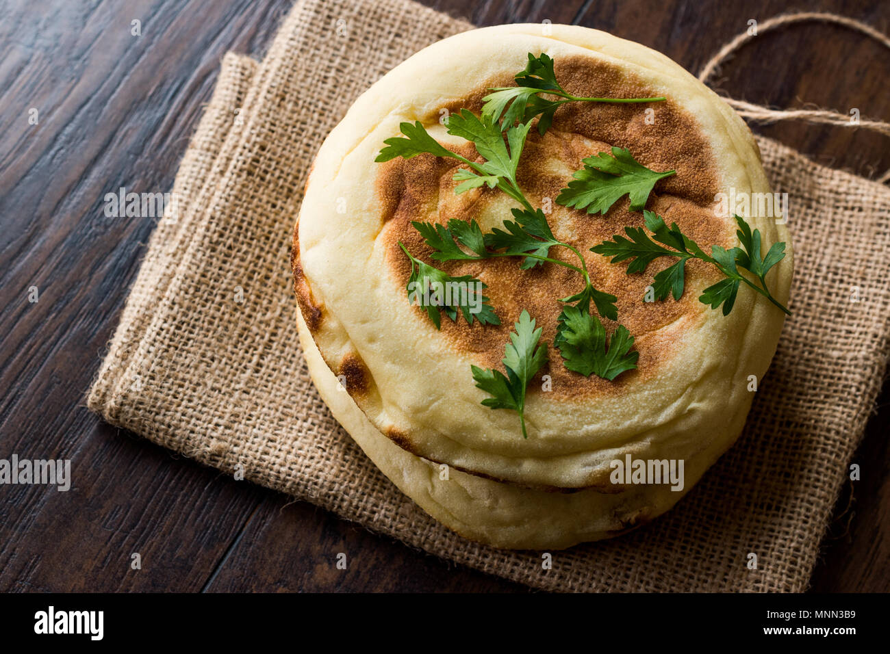 Tandoor cooked naan flatbread hi-res stock photography and images - Alamy