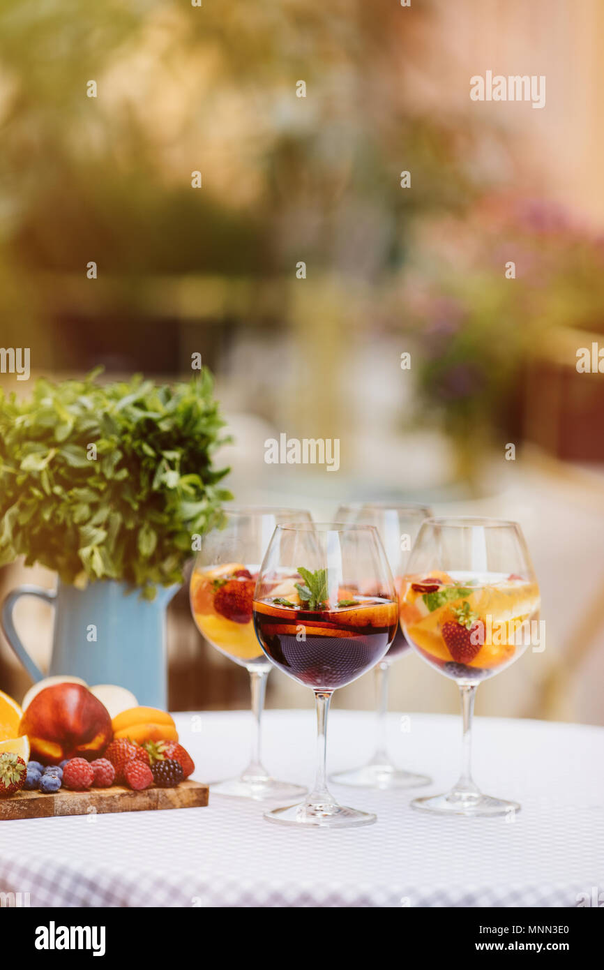 Top view of summer dinks, fruit cocktails on white wood table with ...