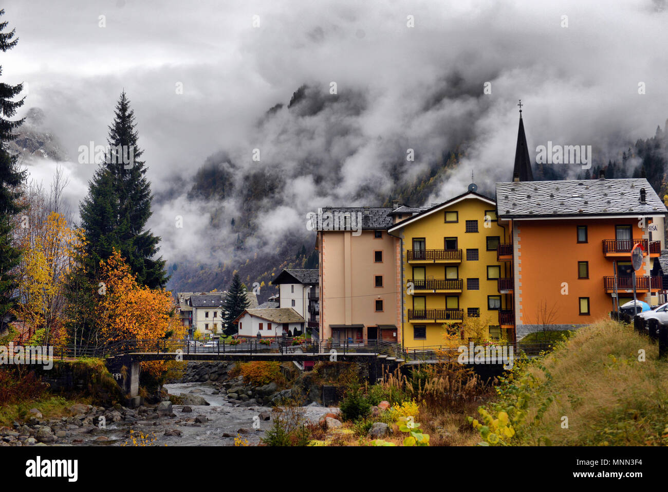 Small Alpine town street with typical houses Stock Photo - Alamy