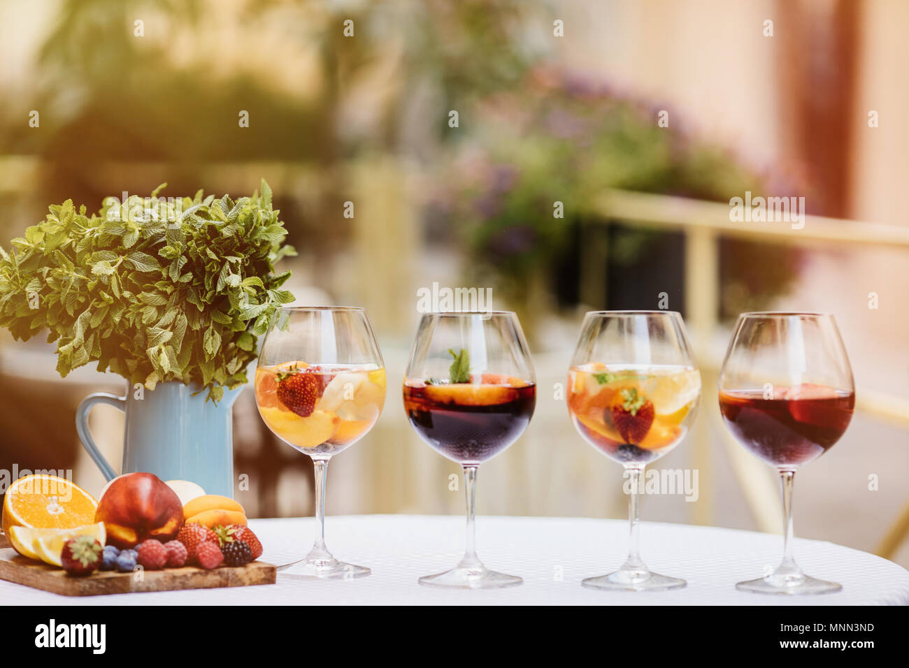 Top view of summer dinks, fruit cocktails on white wood table with ...