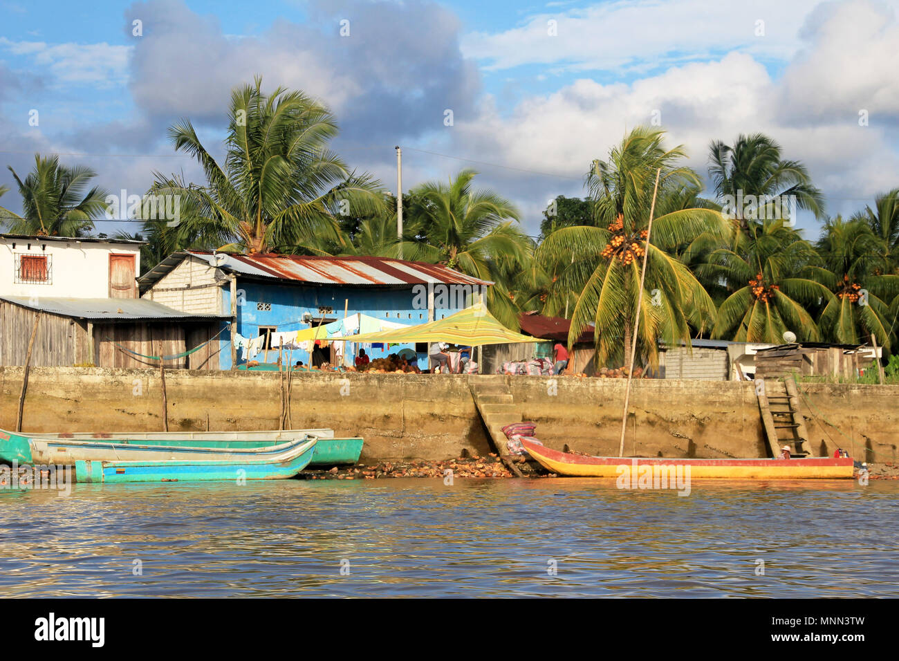 Traditional fishing boats and houses, Cayapas River, Esmeraldas ...