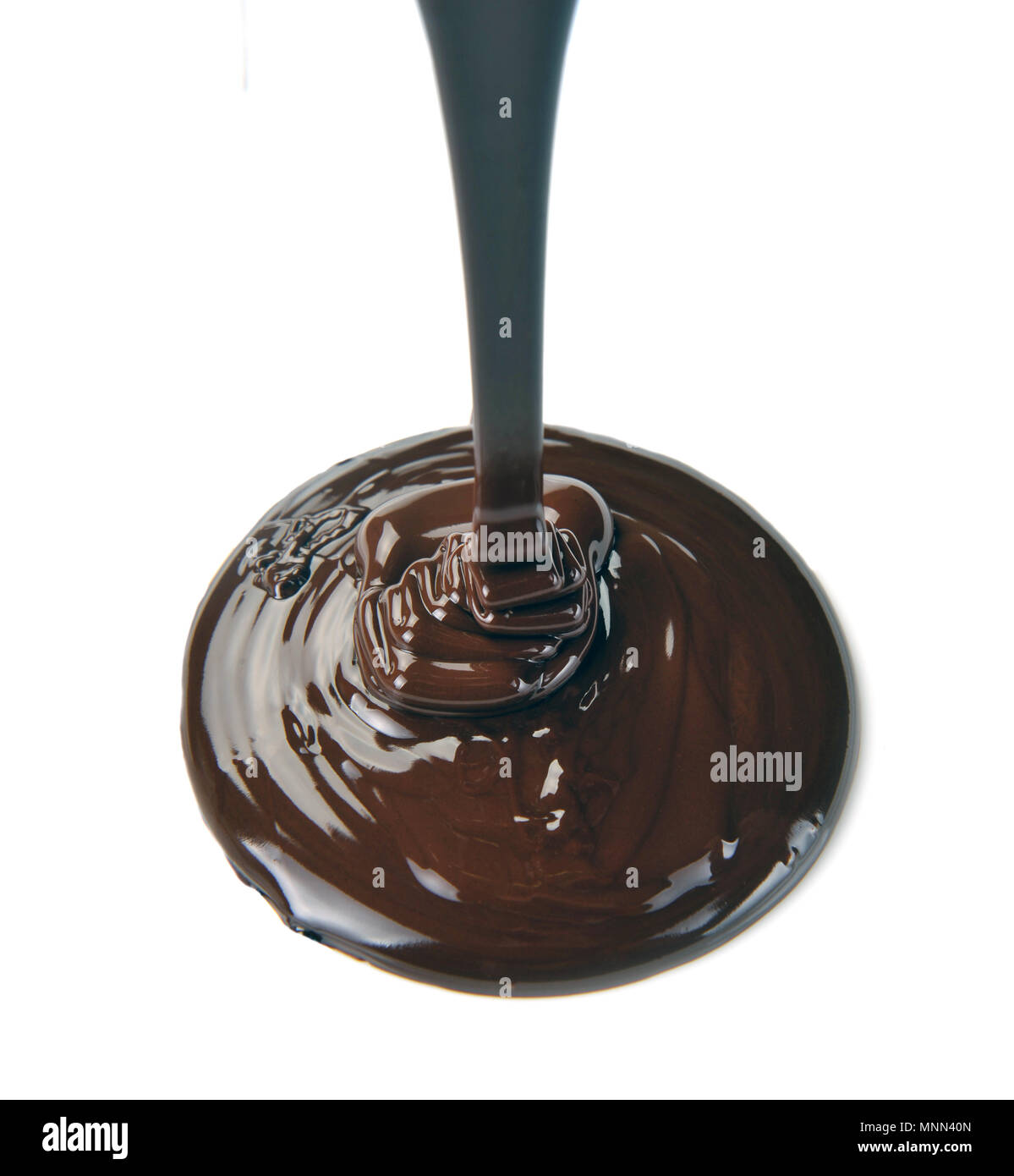 Melted chocolate pouring from cooking hi-res stock photography and ...