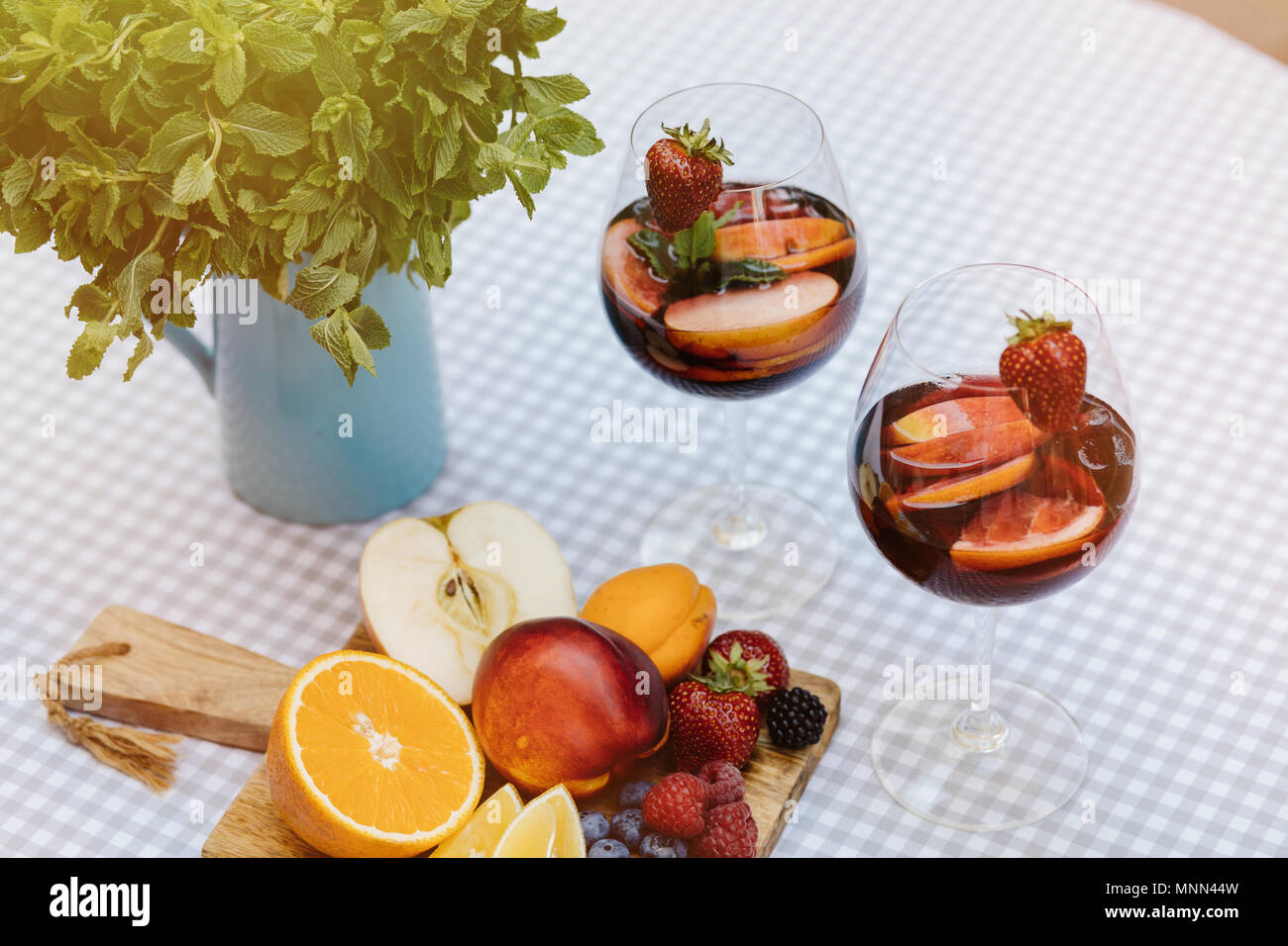 Top view of summer dinks, fruit cocktails on white wood table with ...