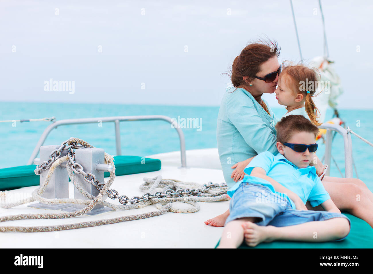 Family of mother and her kids having great time sailing at luxury yacht ...