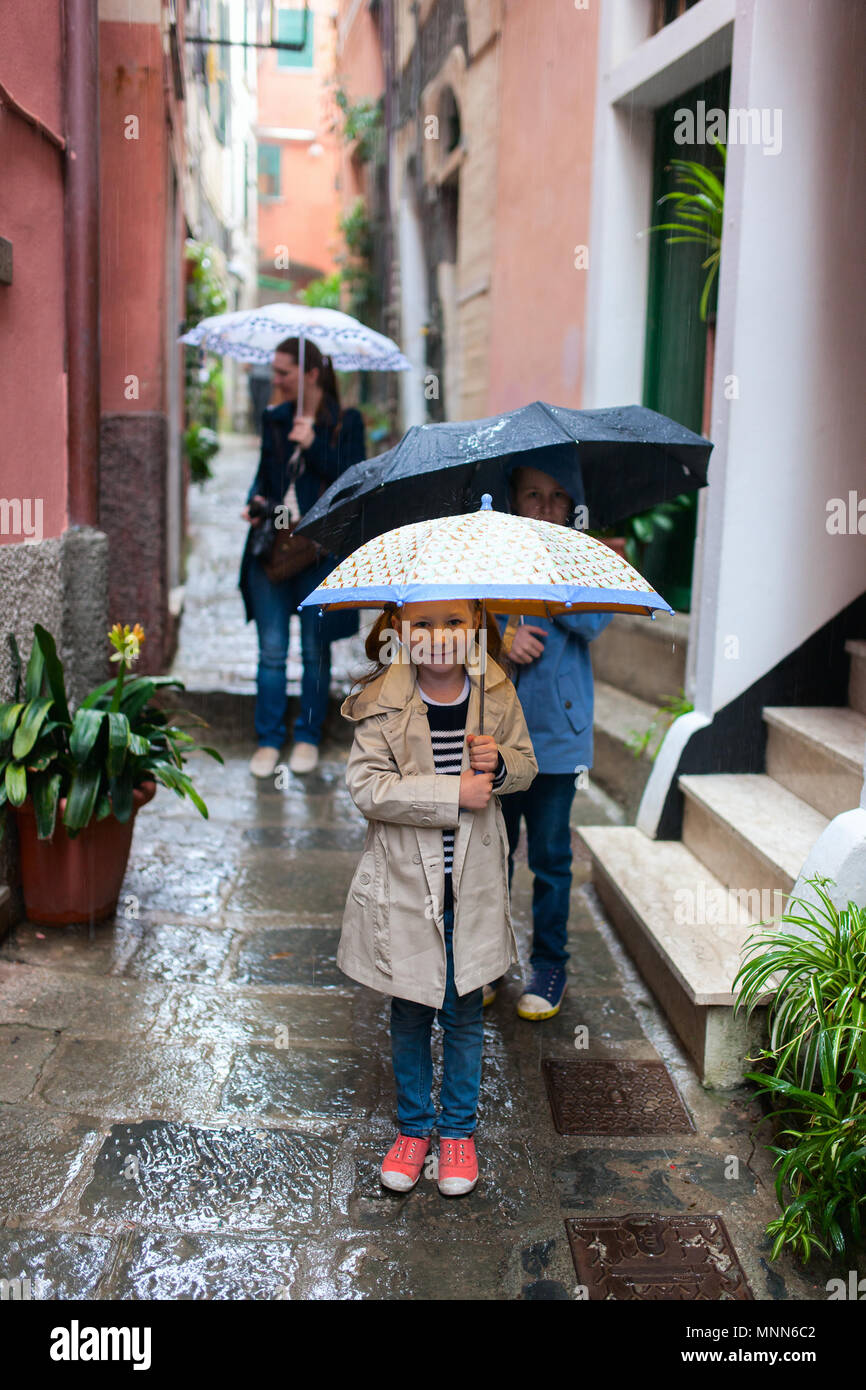 Family of mother and two kids at narrow street of Vernazza village in ...