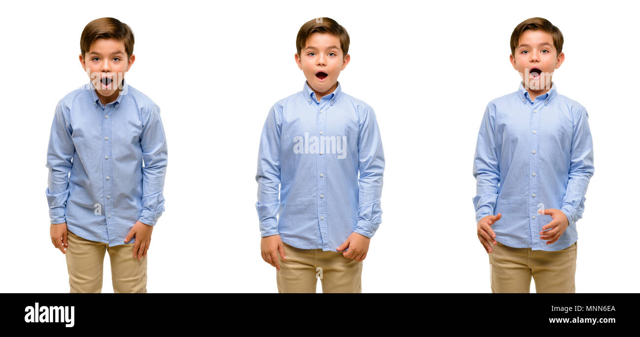 Handsome toddler child with green eyes scared in shock, expressing ...