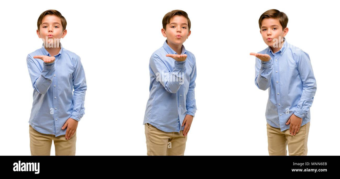 Handsome toddler child with green eyes expressing love, blows kiss at ...