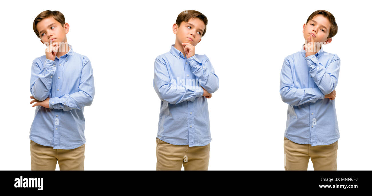 Handsome toddler child with green eyes doubt expression, confuse and ...