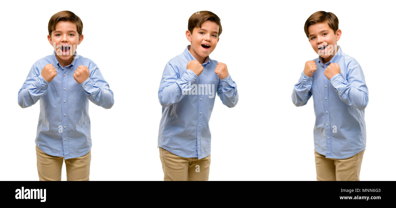 Handsome toddler child with green eyes happy and excited expressing ...