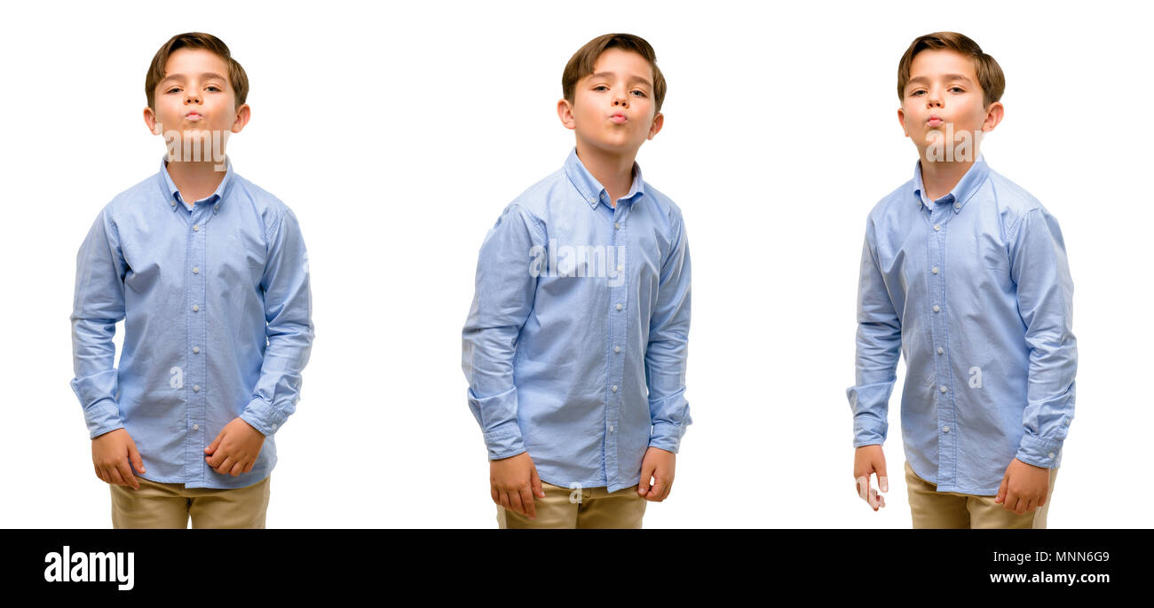 Handsome toddler child with green eyes expressing love, blows kiss at ...