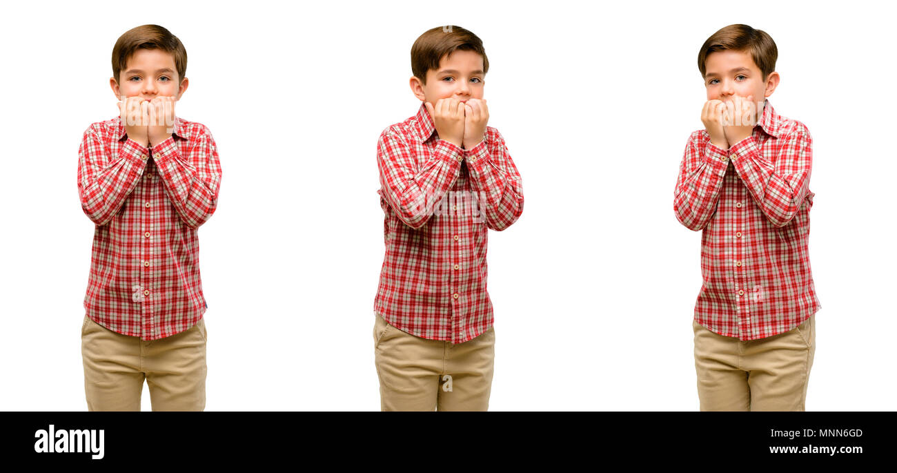 Handsome toddler child with green eyes terrified and nervous expressing ...