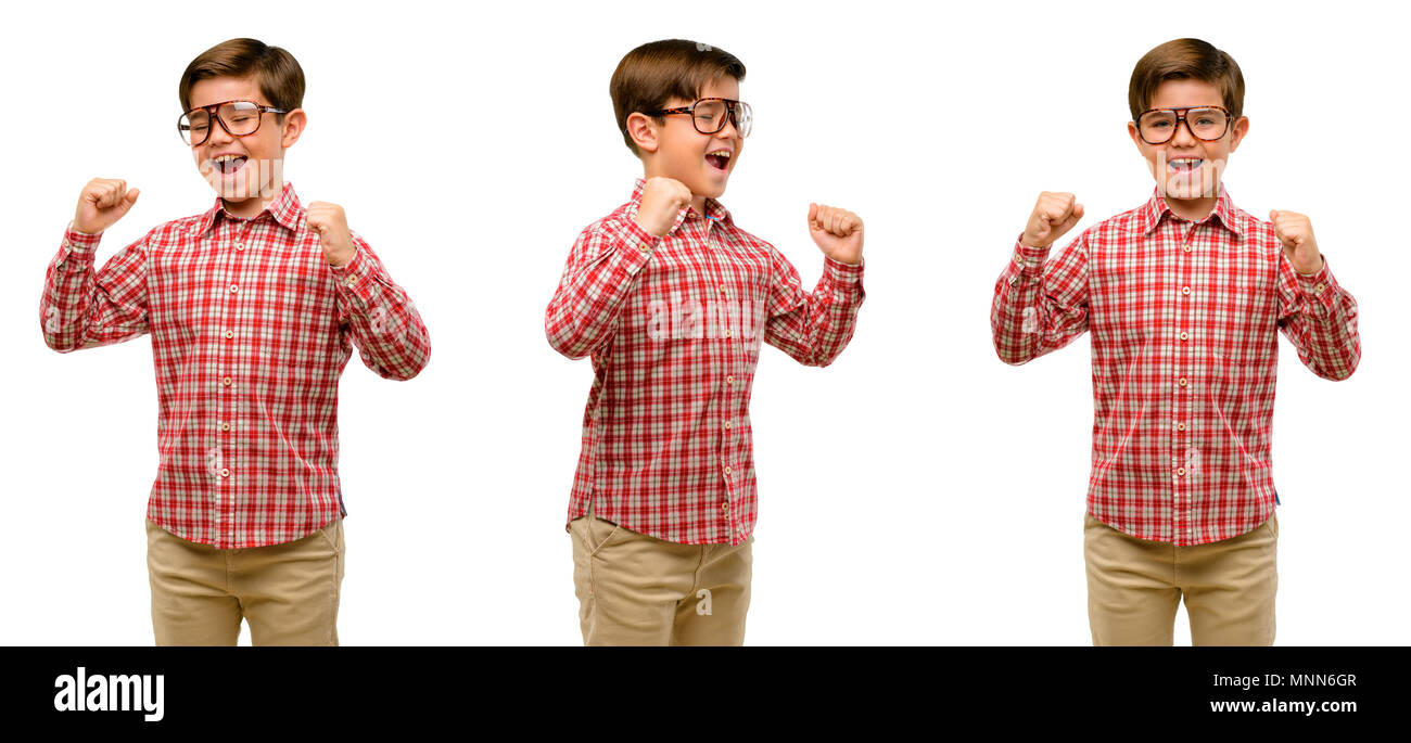 Handsome toddler child with green eyes happy and excited expressing ...