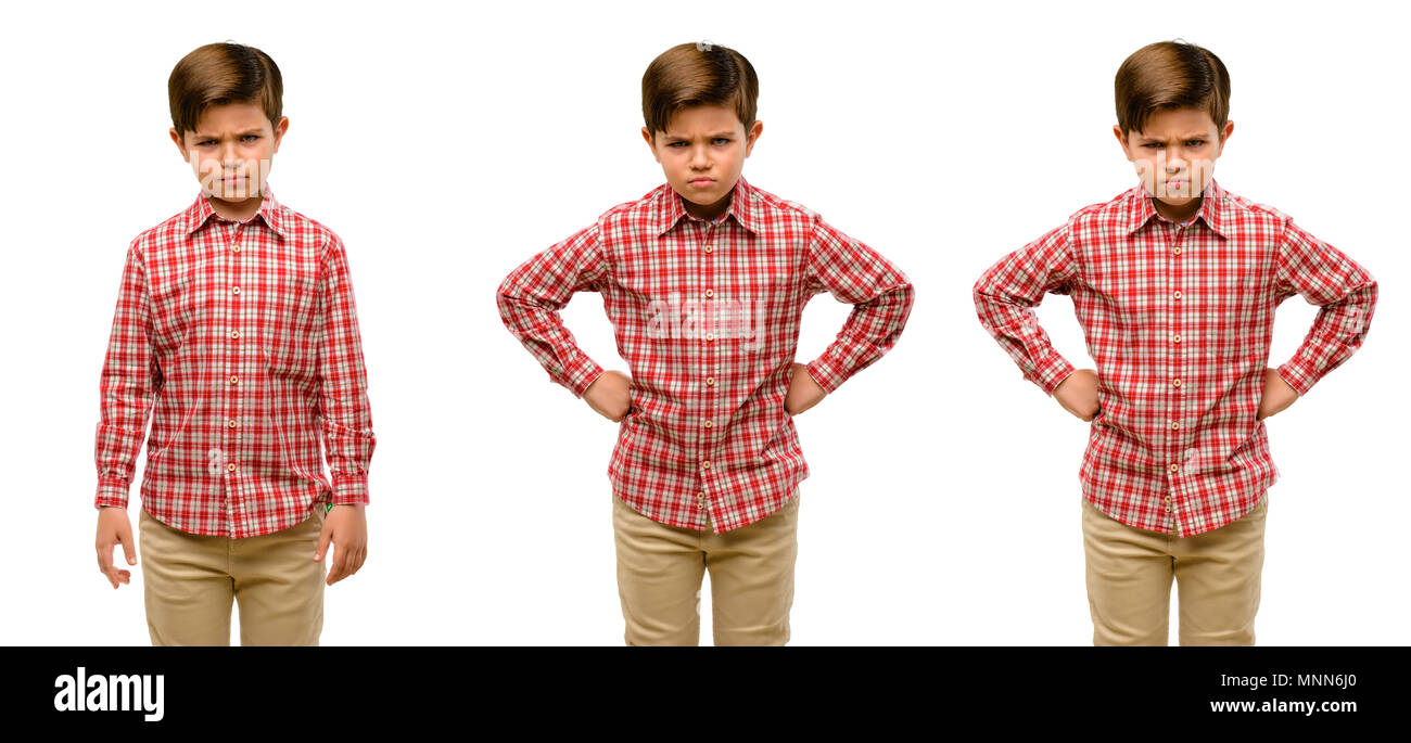 Handsome toddler child with green eyes irritated and angry expressing ...