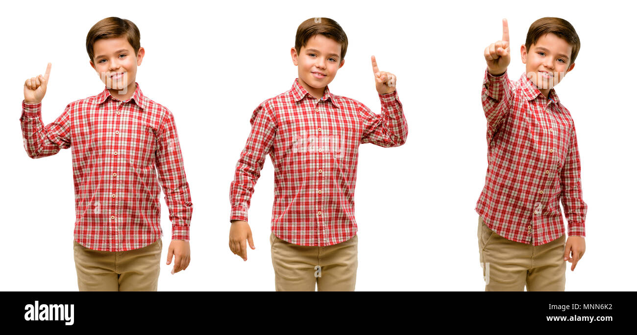 Handsome toddler child with green eyes raising finger, the number one ...