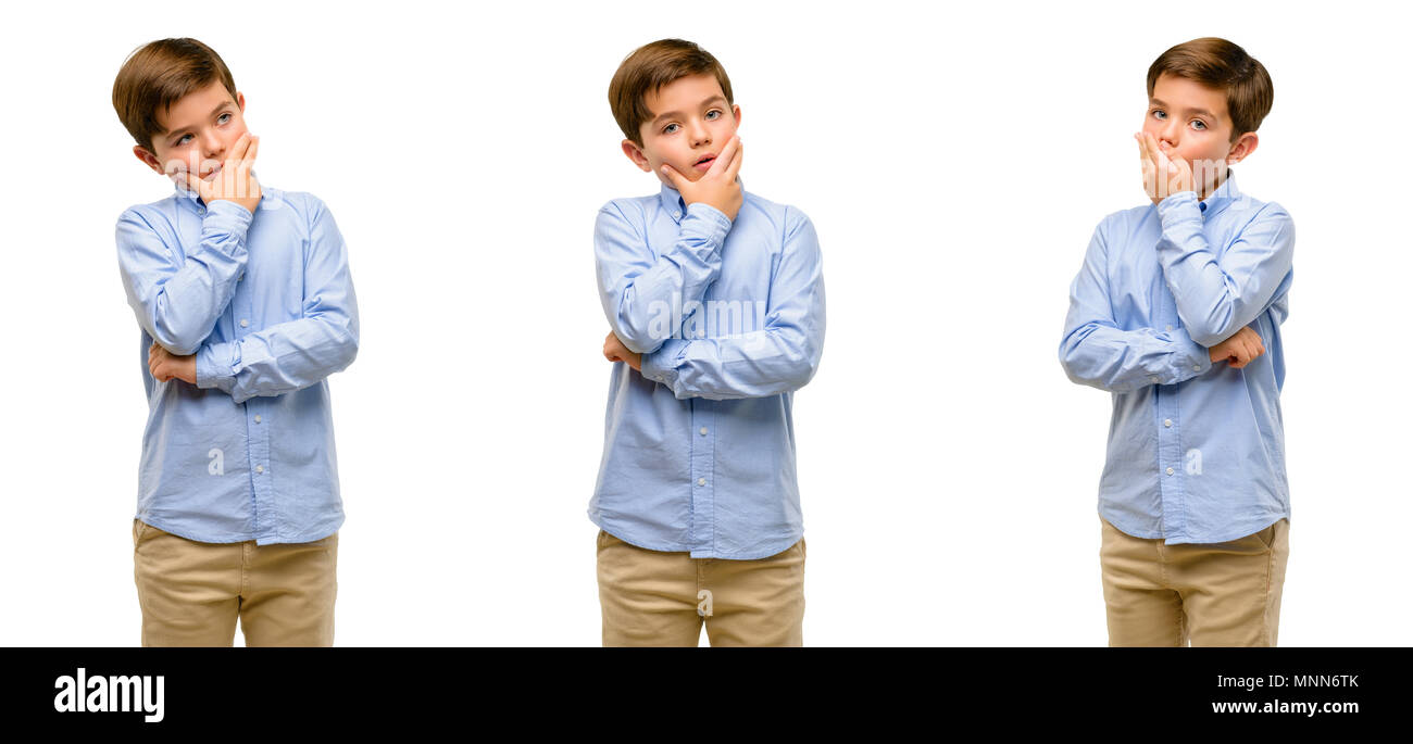 Handsome toddler child with green eyes scared in shock, expressing ...