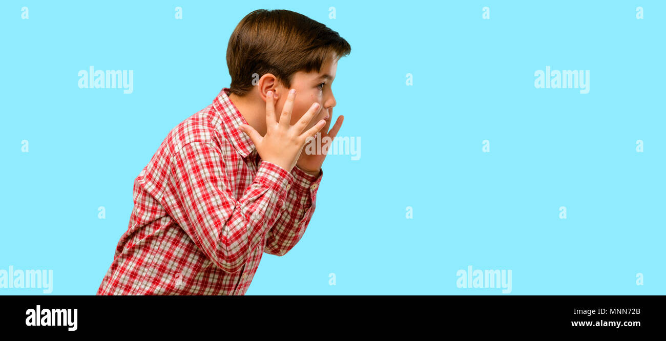 Handsome toddler child with green eyes stressful keeping hands on head ...