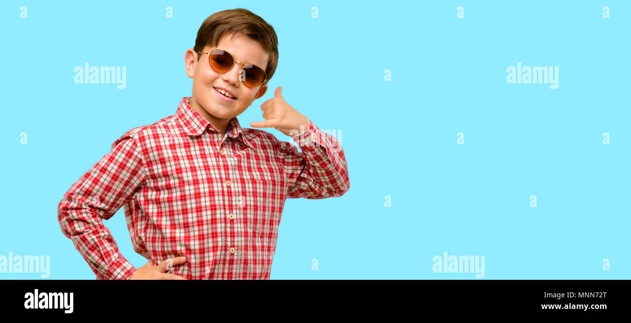 Handsome toddler child with green eyes happy and excited making showing ...