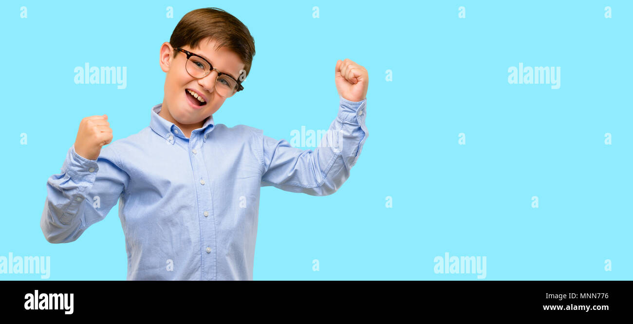 Handsome toddler child with green eyes happy and excited celebrating ...