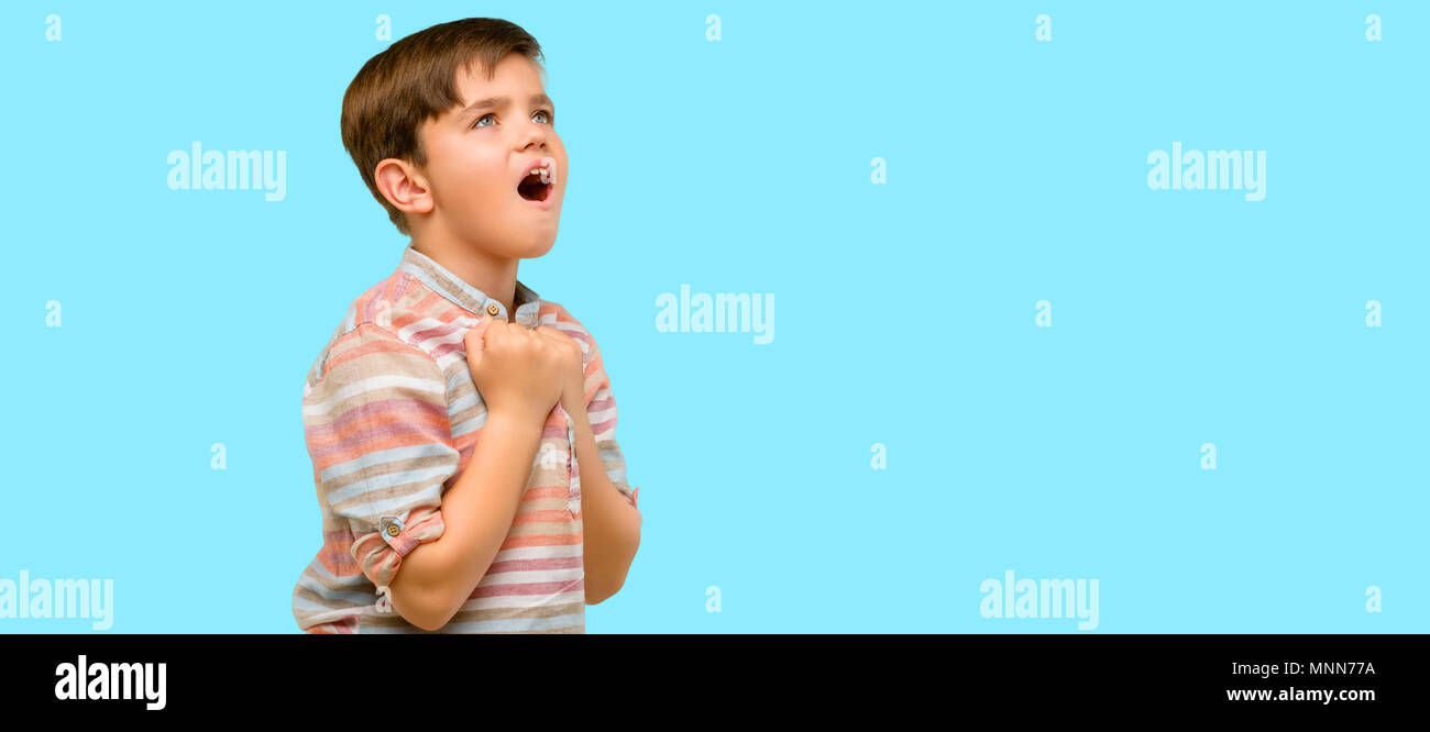 Handsome toddler child with green eyes happy and excited celebrating ...