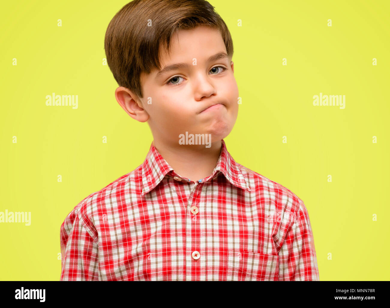 Handsome toddler child with green eyes making funny face fooling over ...