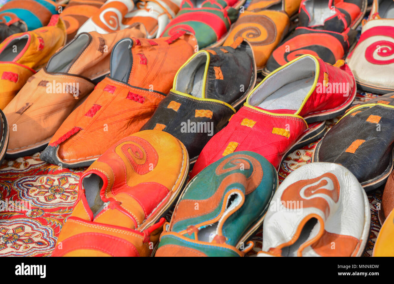 Colorful Slippers at the sale counter in souvenir market Stock Photo ...